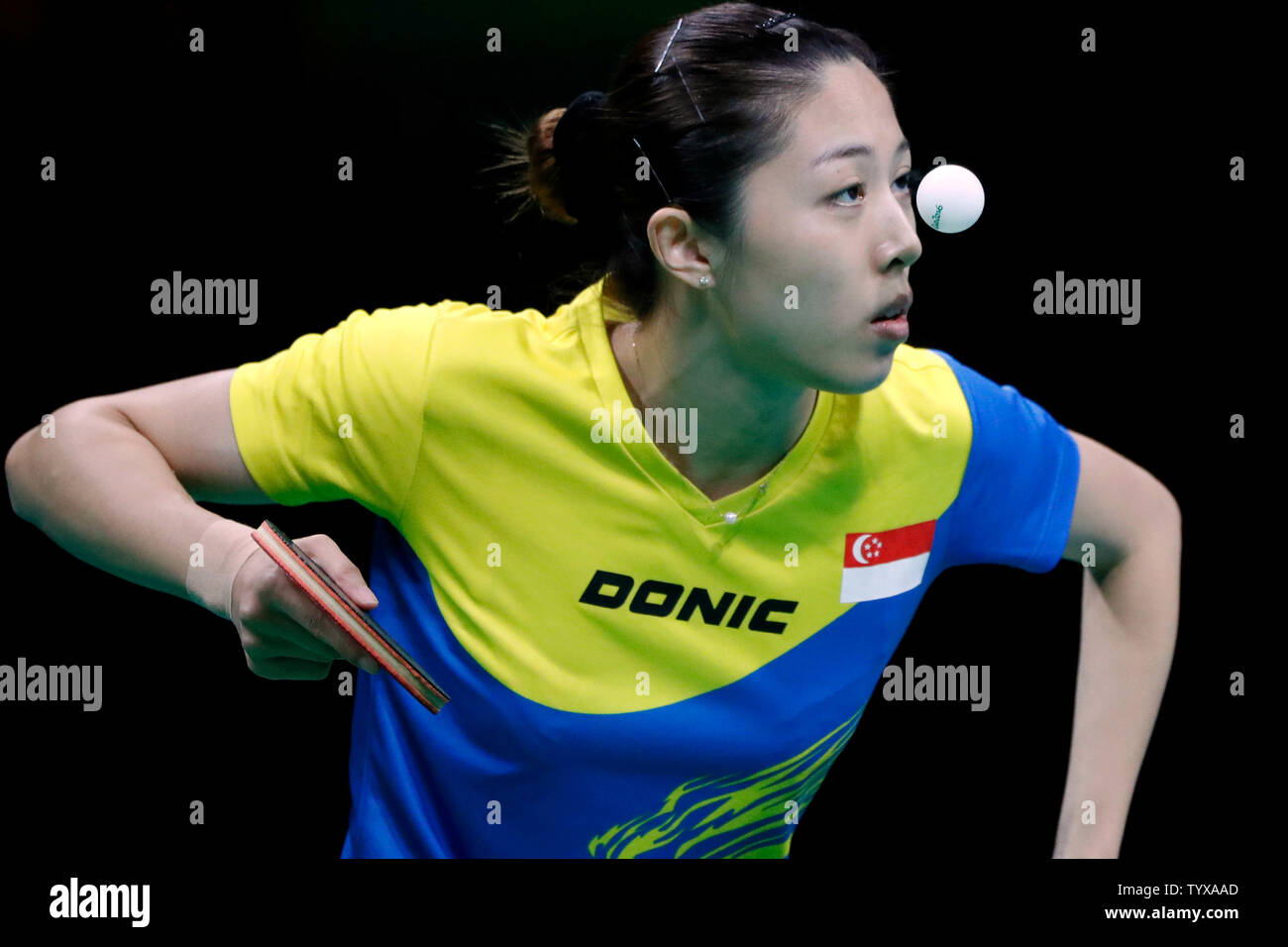 Singapore's Mengyu Yu serves the ball against Japan in the Women's Team ...
