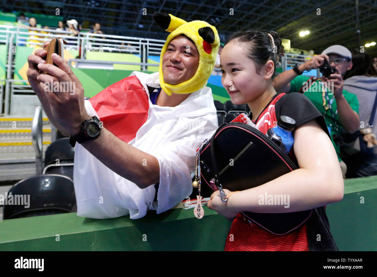 Japan's Mima Ito poses for photo with a fan after Japan defeated ...
