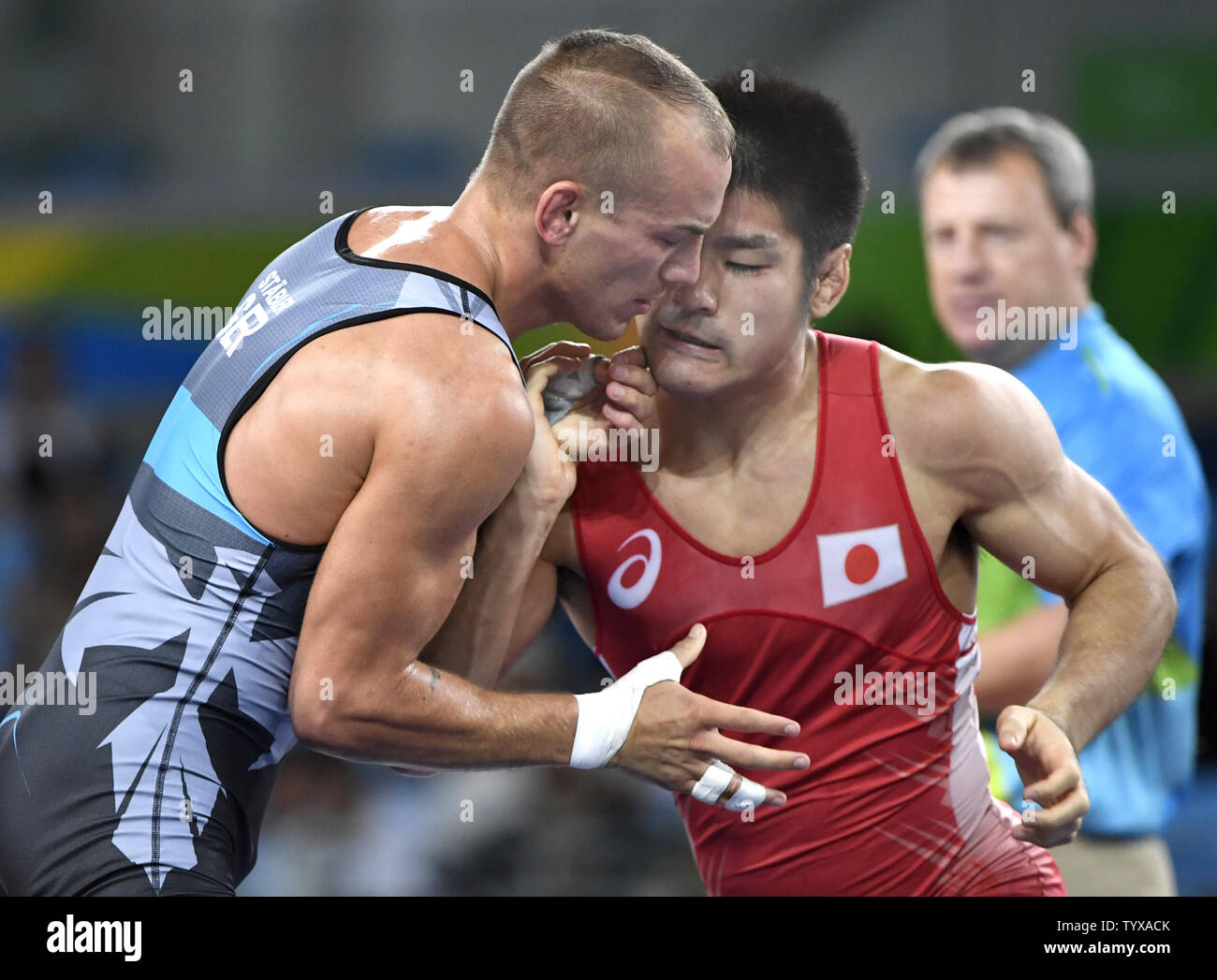 Japan's Tomohiro Inoue (R) and Germany's Frank Staebler in action during the Men's Greco-Roman ...