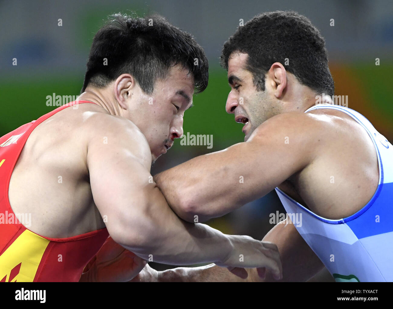 Iran's Ghasem Gholamreza Rezaei (R) and China's di Xiao in action ...