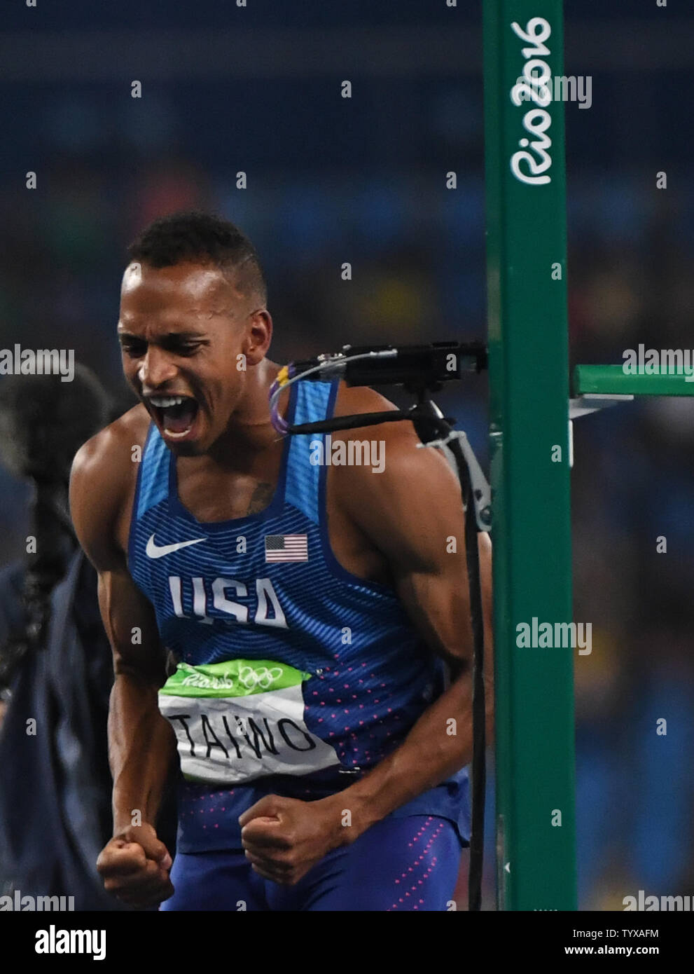 Jeremy Taiwo of the United States reacts after a jump when he competes ...