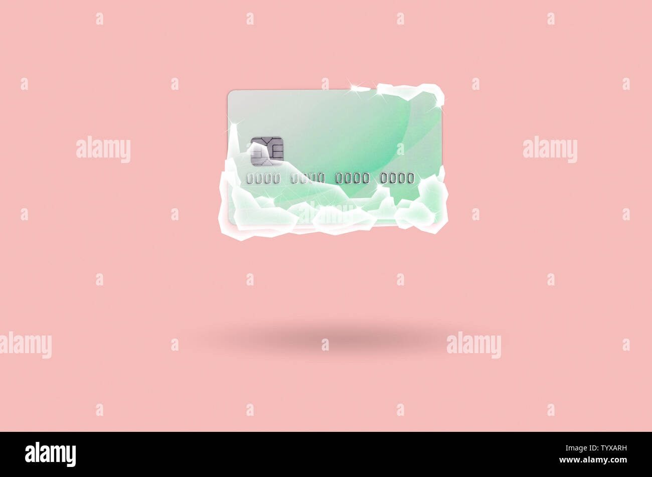 Frozen green credit card in a blocks of ice on coral background. The ...