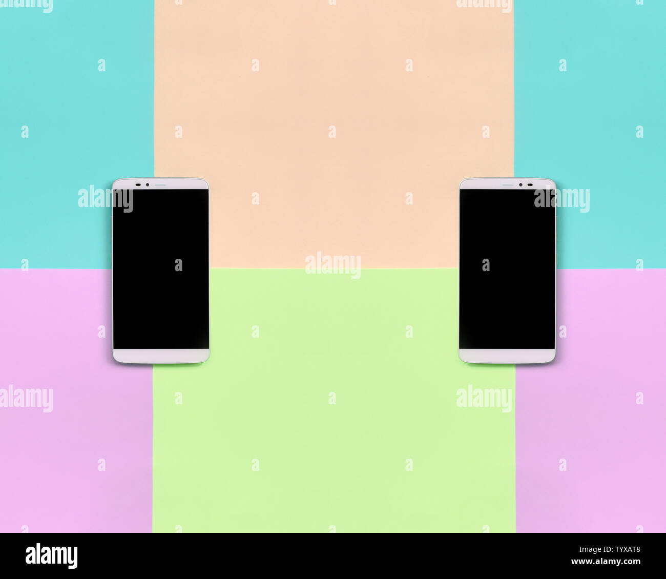 Two modern smartphones with black screens on texture background of ...