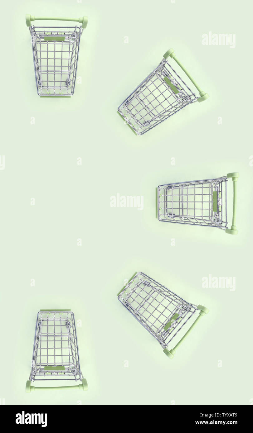Pattern of many small shopping carts on a lime background. Minimalism ...