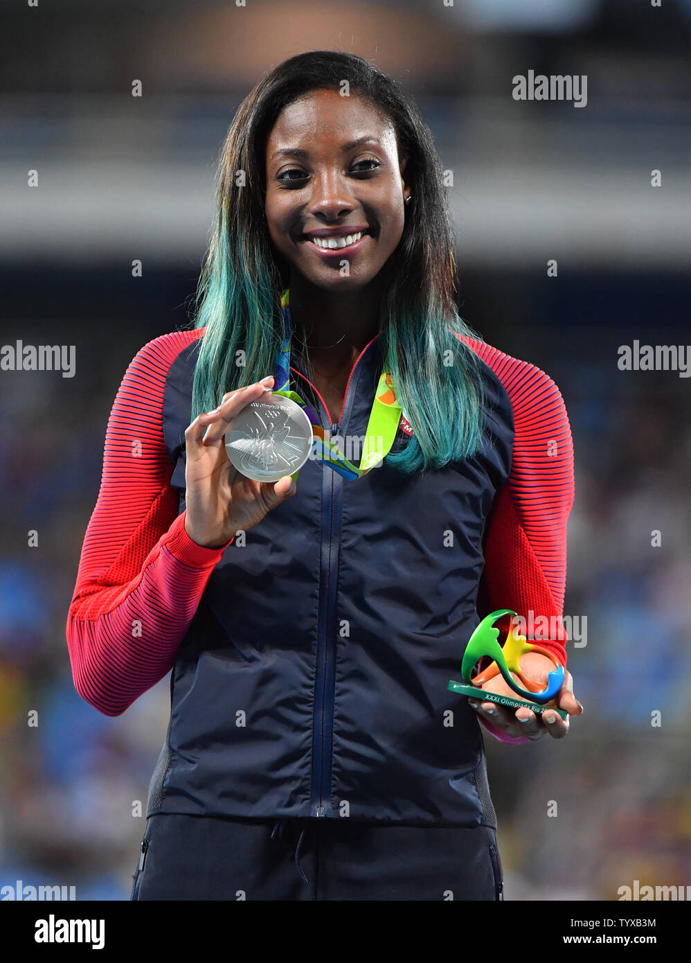 Silver medalist Nia Ali of the United States holds her medal at the ...