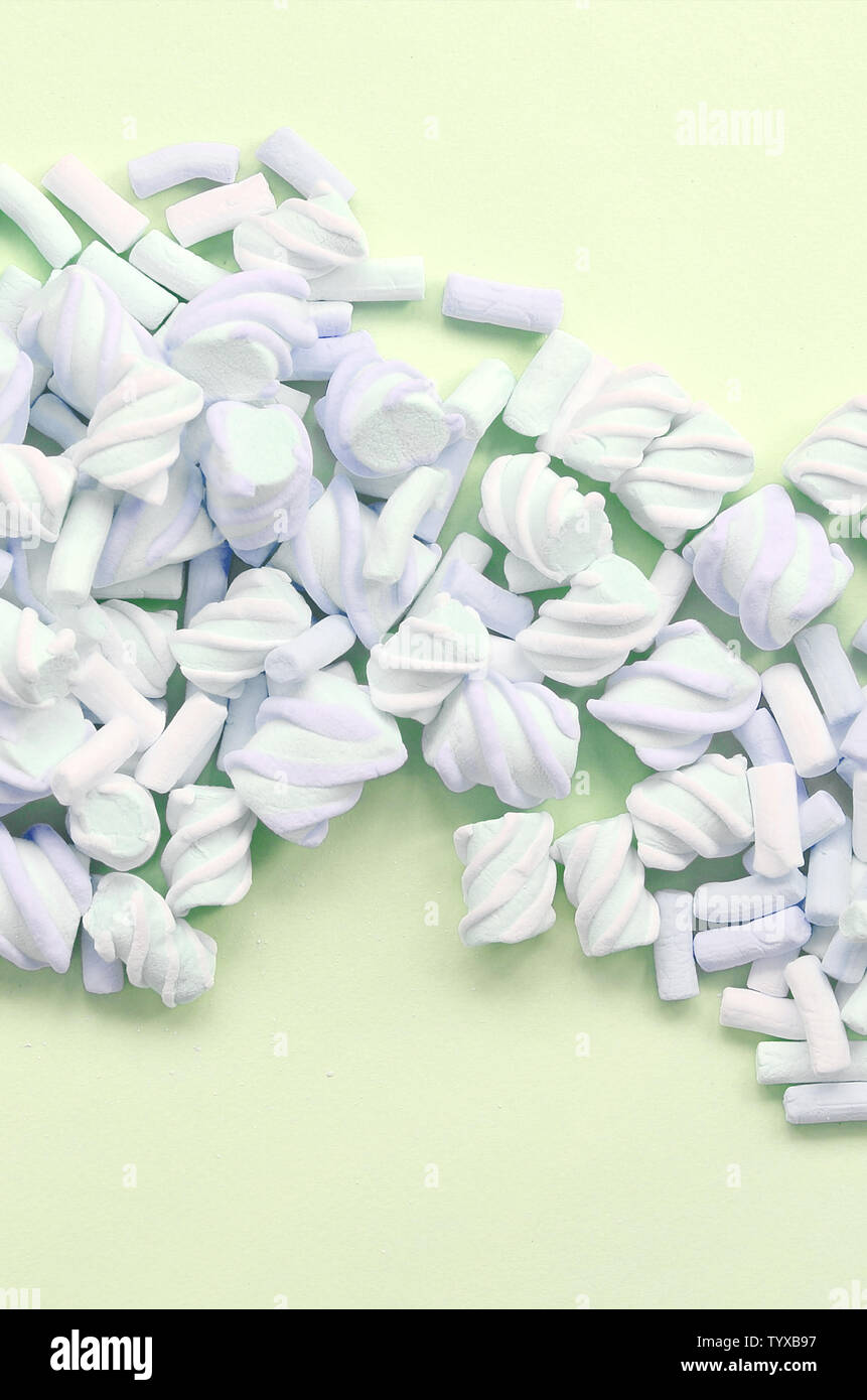 Colorful marshmallow laid out on lime paper background. pastel creative ...