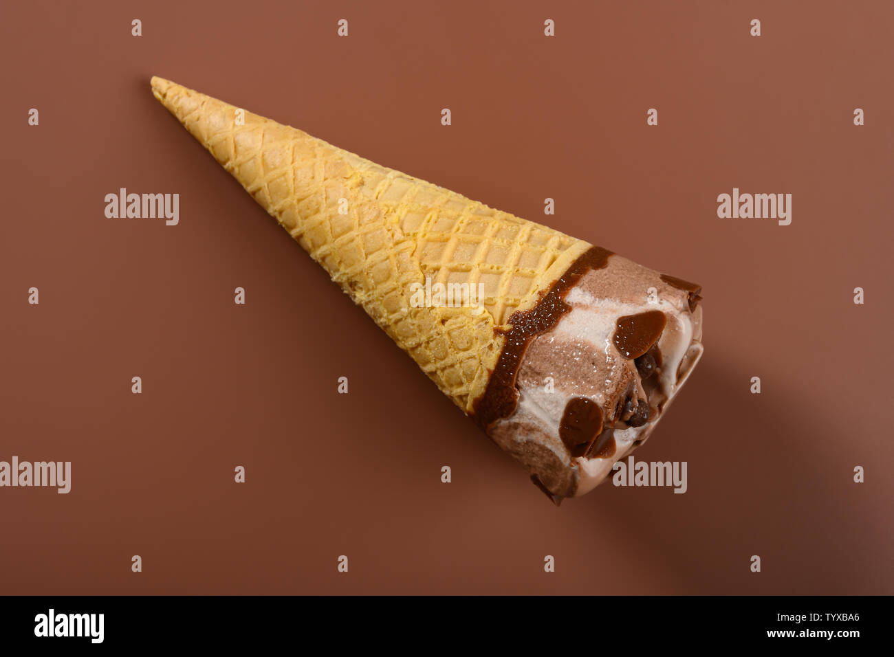 top view coffee and chocolate flavor ice cream cone on brown background ...