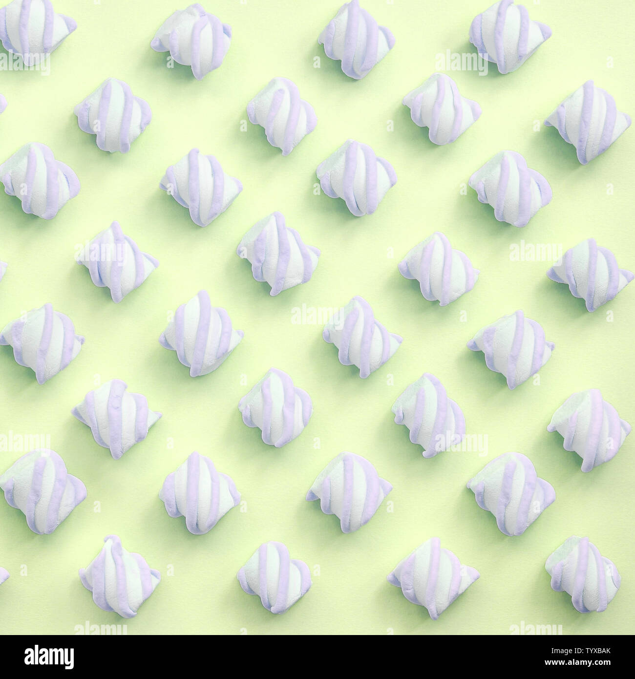 Colorful marshmallow laid out on lime paper background. pastel creative ...