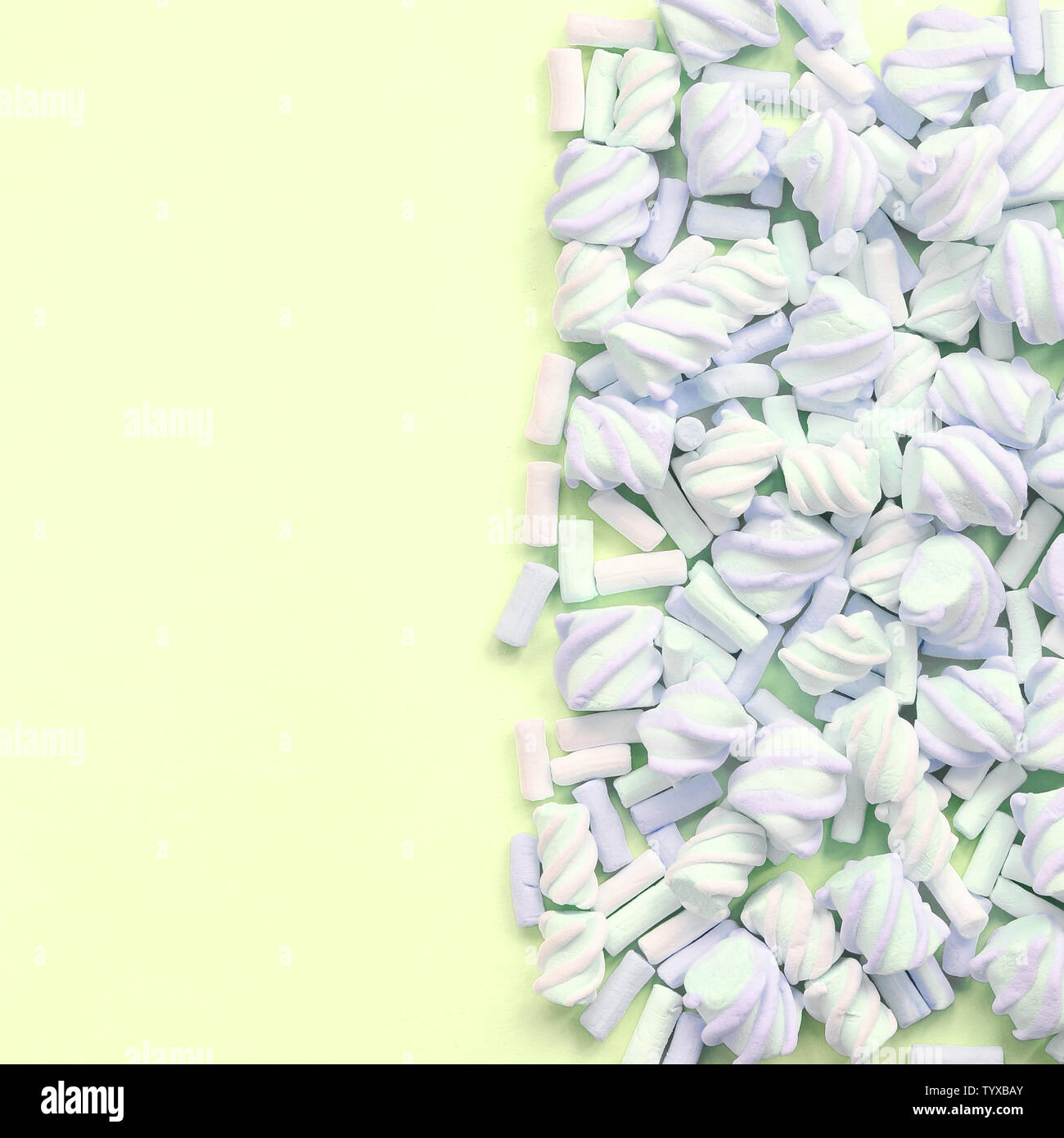 Colorful marshmallow laid out on lime paper background. pastel creative ...
