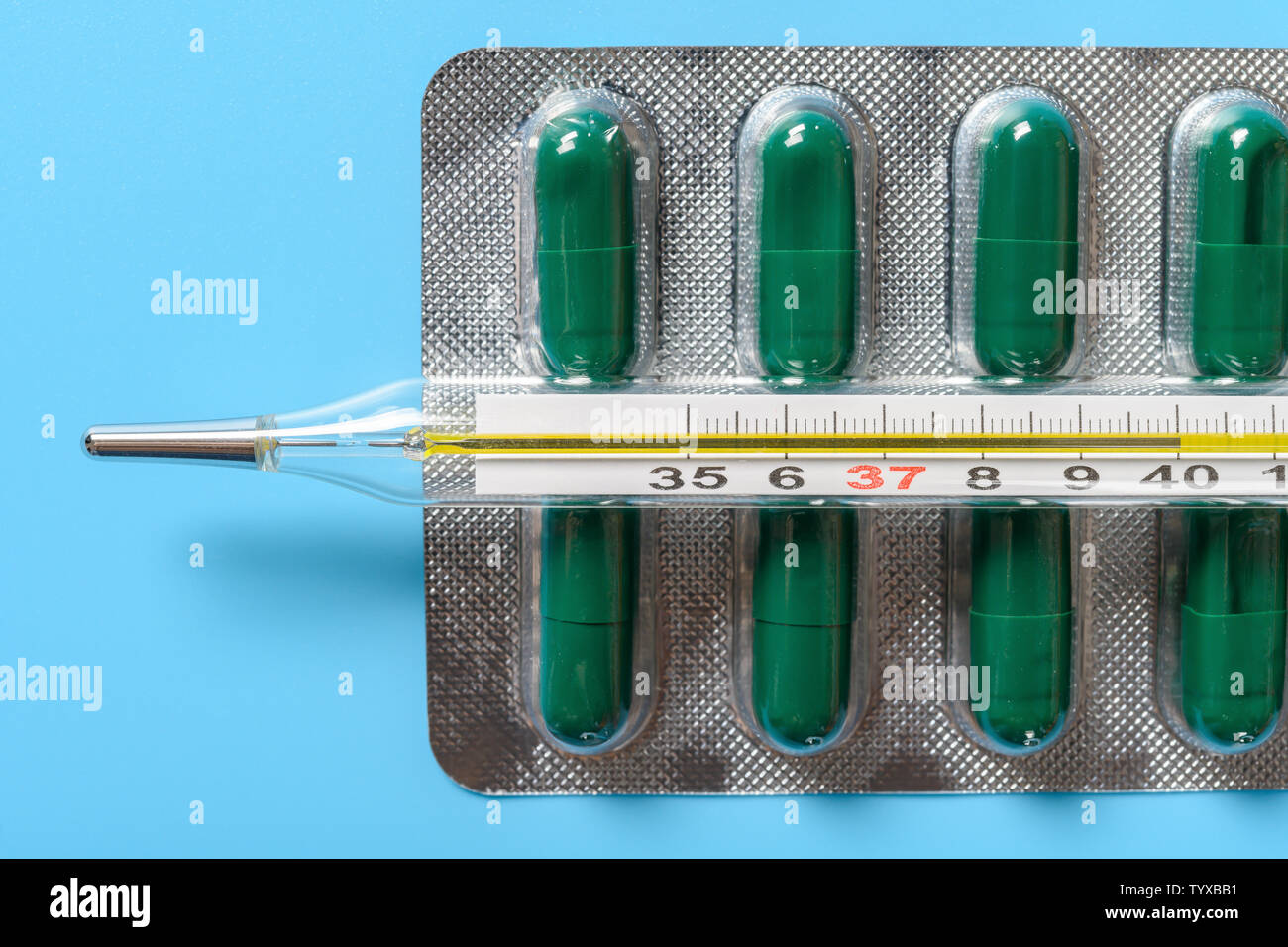 mercury thermometer at 40 degrees centigrade on top of capsules Stock ...