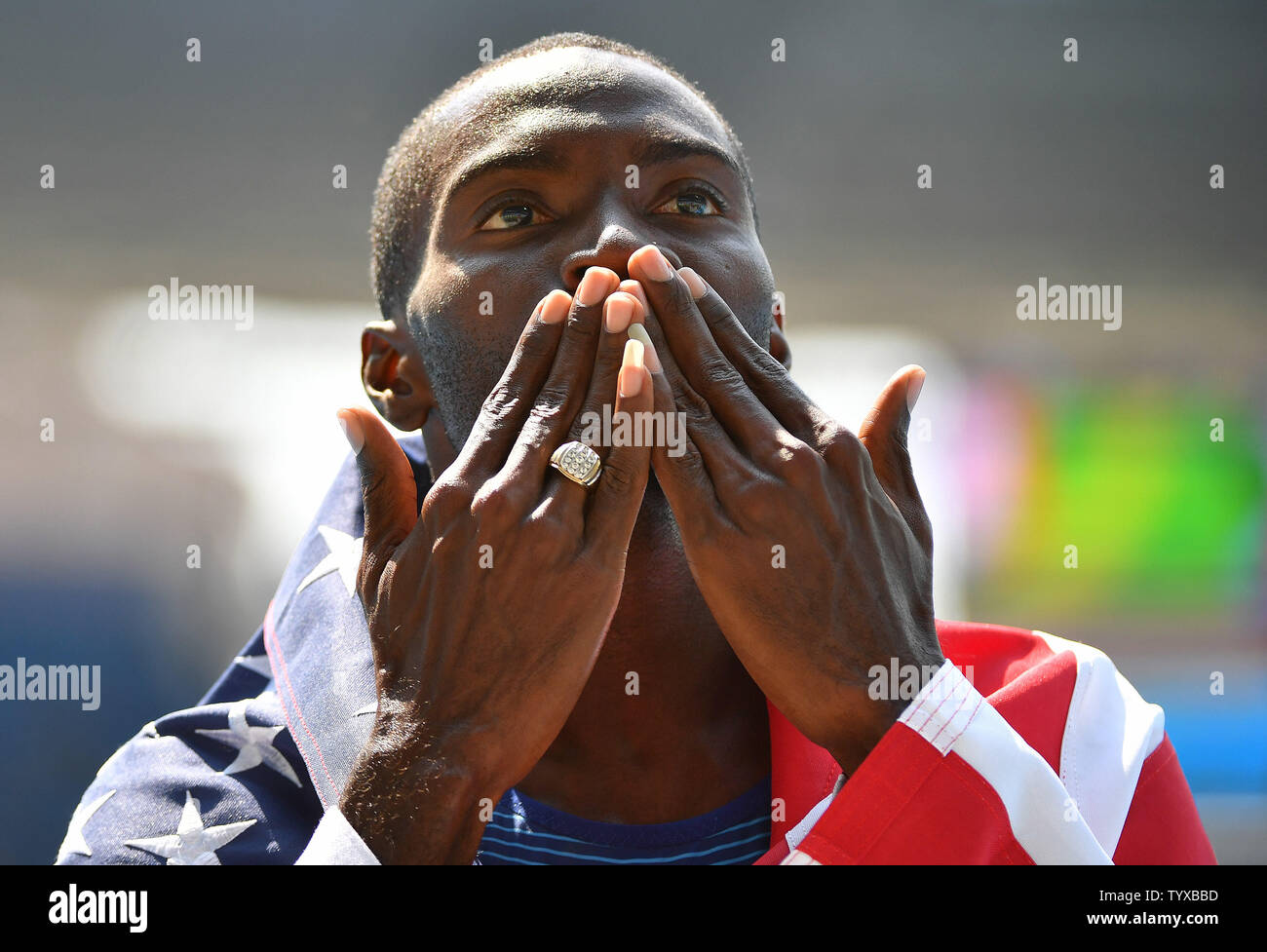 Kerron Clement of the United States blows kisses to the crowd after ...