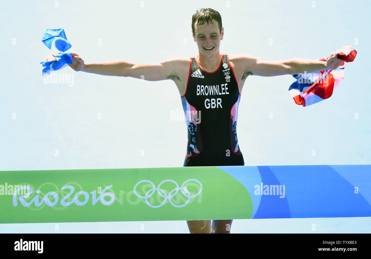 Great Britain's Alistair Brownlee hits the finish line to win the Men's ...