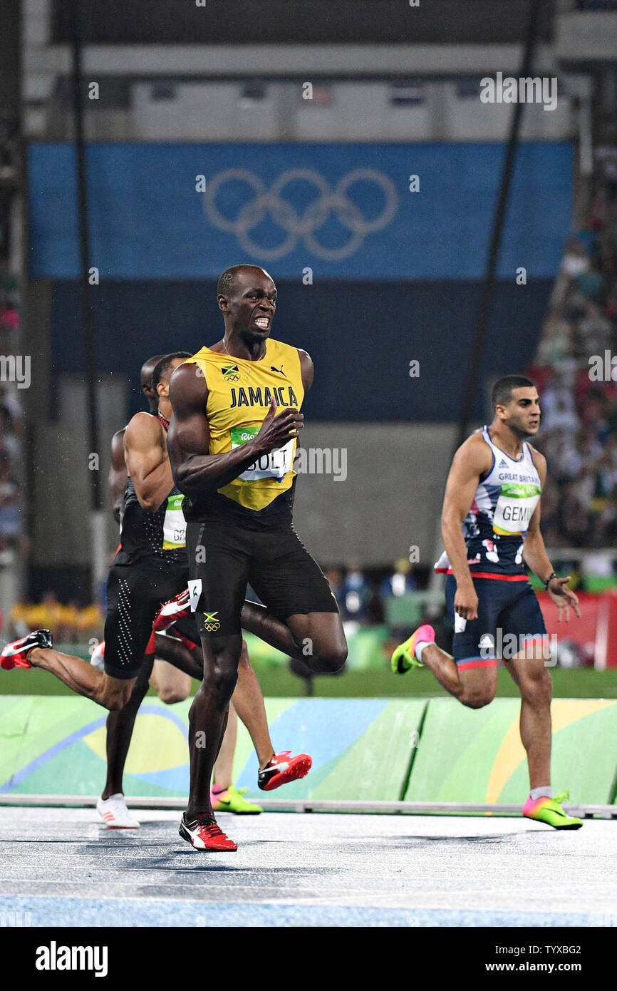Usain Bolt of Jamaica pulls ahead during the Men's 200m Final at the ...
