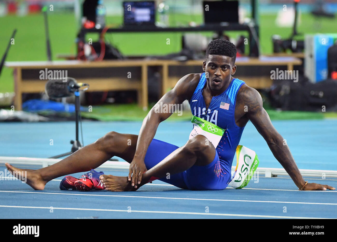 Trayvon Bromell of the United States remains on the track after the Men ...