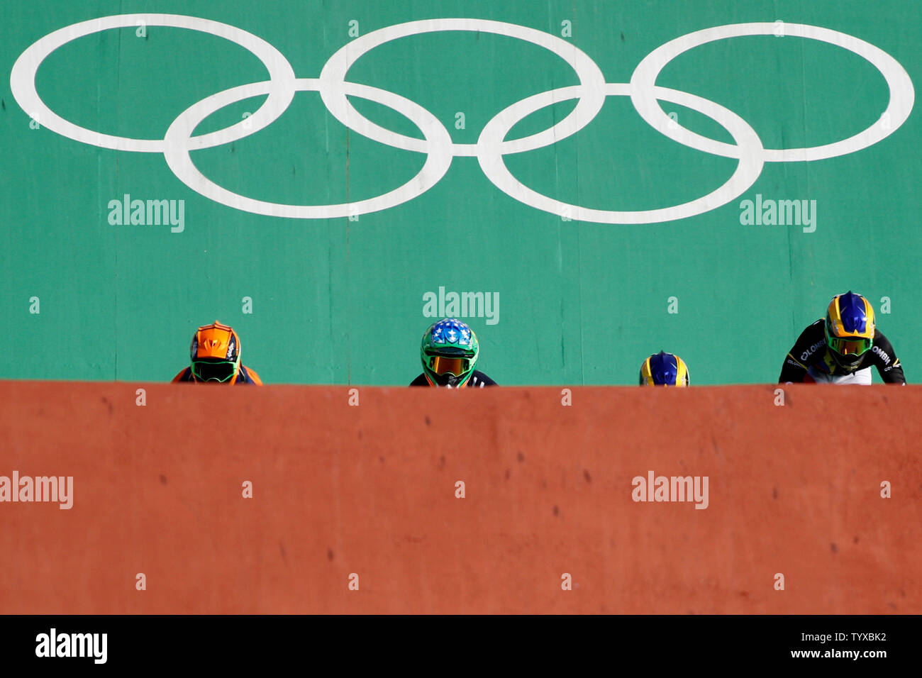 Riders approach the first jump in a Men's BMX Cycling semifinal in the ...