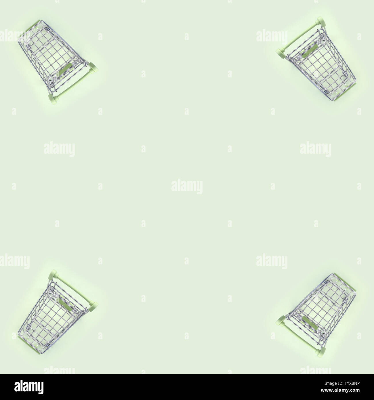 Pattern of many small shopping carts on a lime background. Minimalism ...