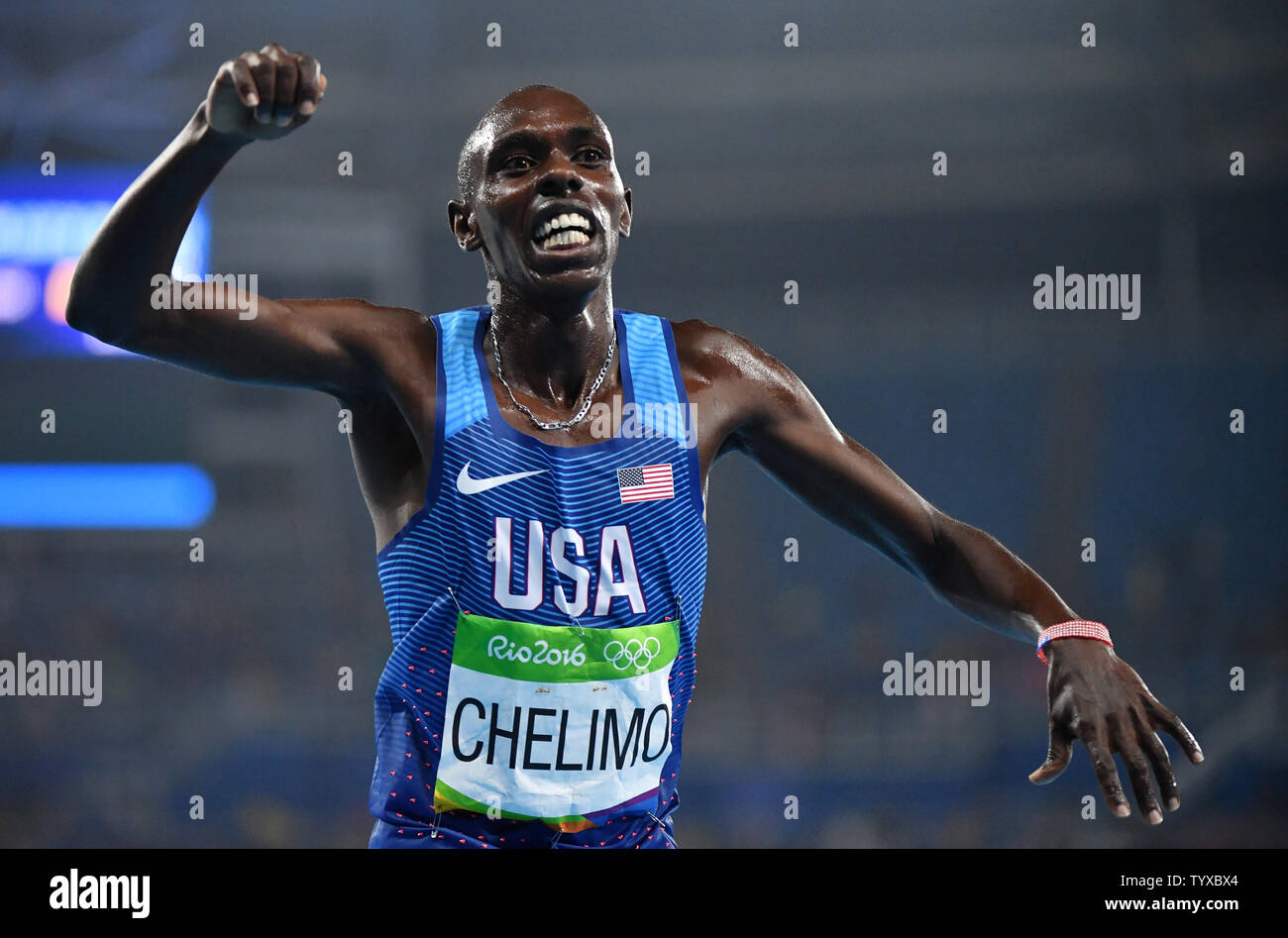 Paul Kipkemoi Chelimo of the United States reacts after crossing the ...