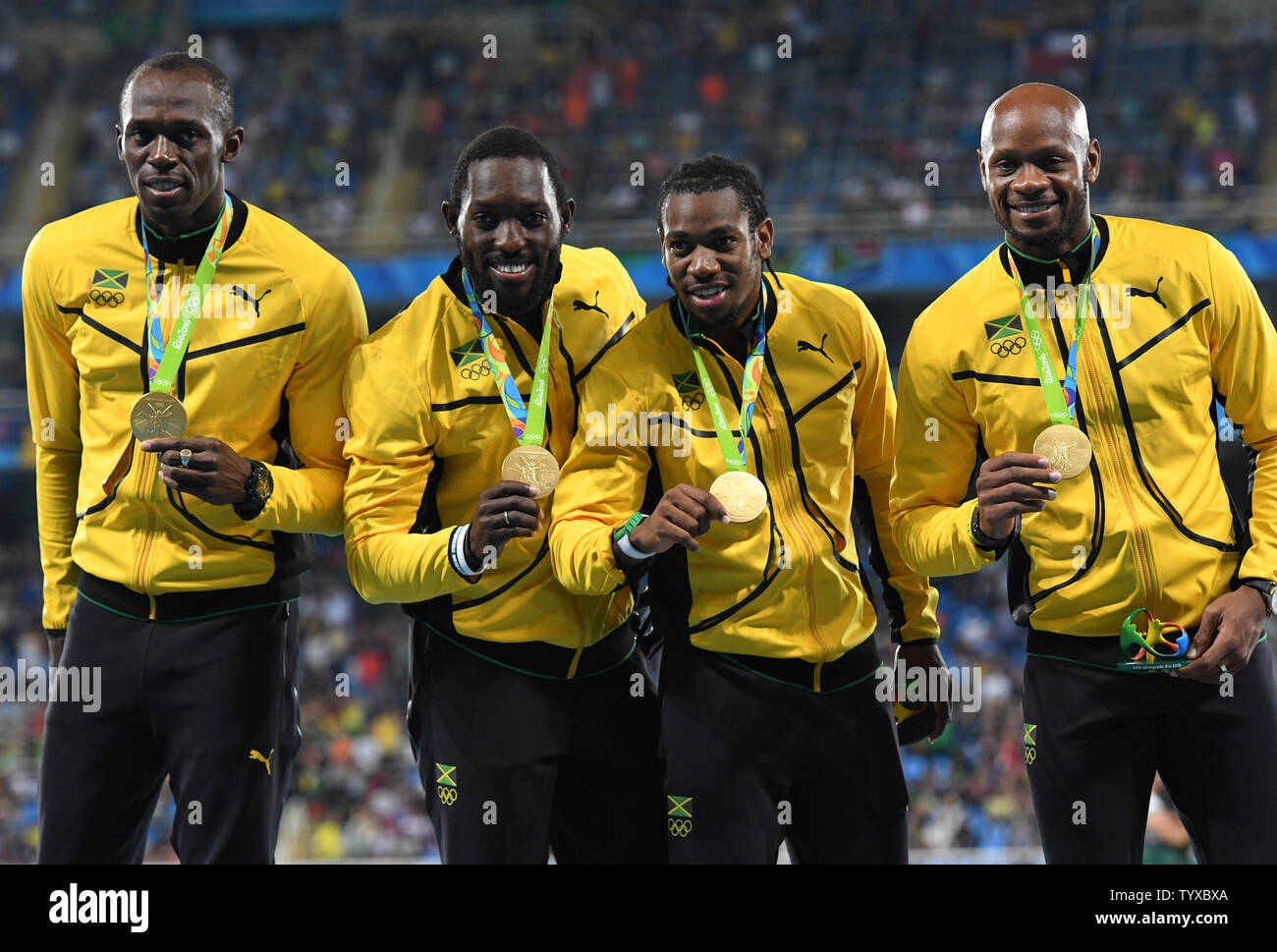 Gold medalists Asafa Powell, Yohan Blake, Nickel Ashmeade and Usain ...
