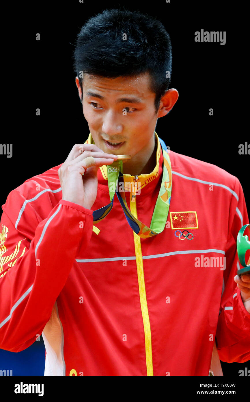 China's Long Chen kisses his gold medal in Men's Badminton Singles ...