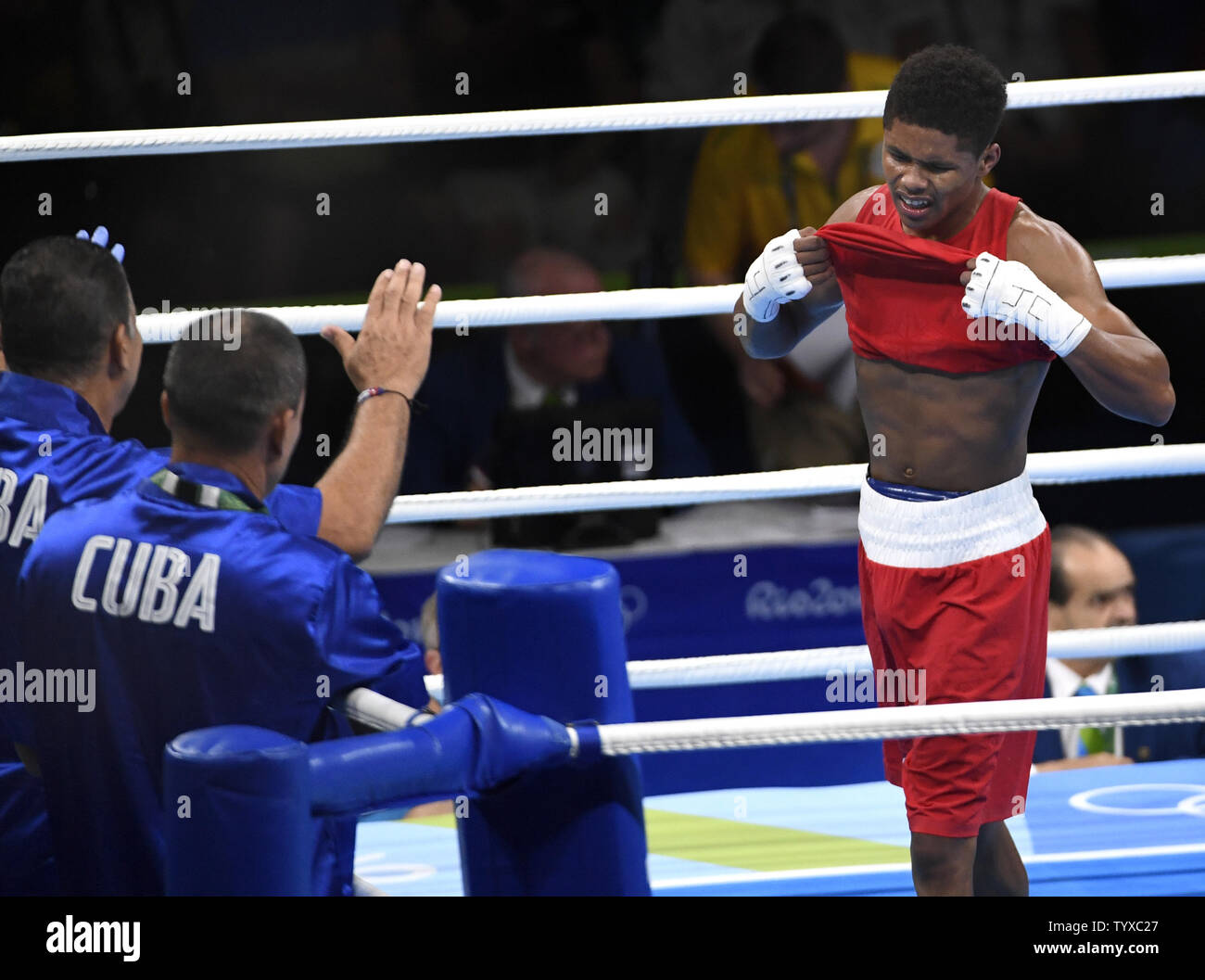 United States' boxer Shakur Stevenson prepares to pull his shirt over ...