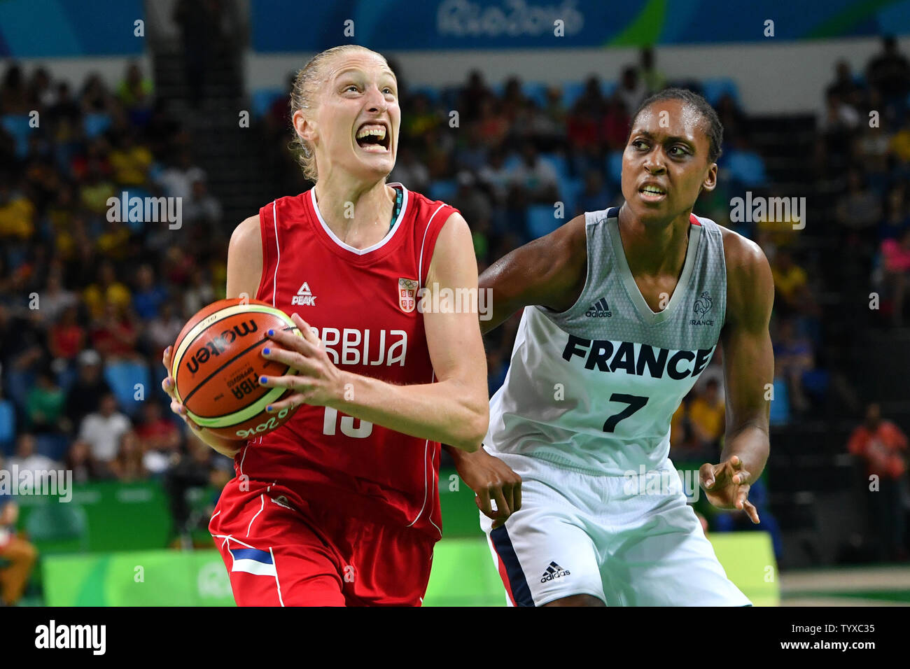 Danielle Page (15) of Serbia moves for the shot against Sandrine Gruda ...