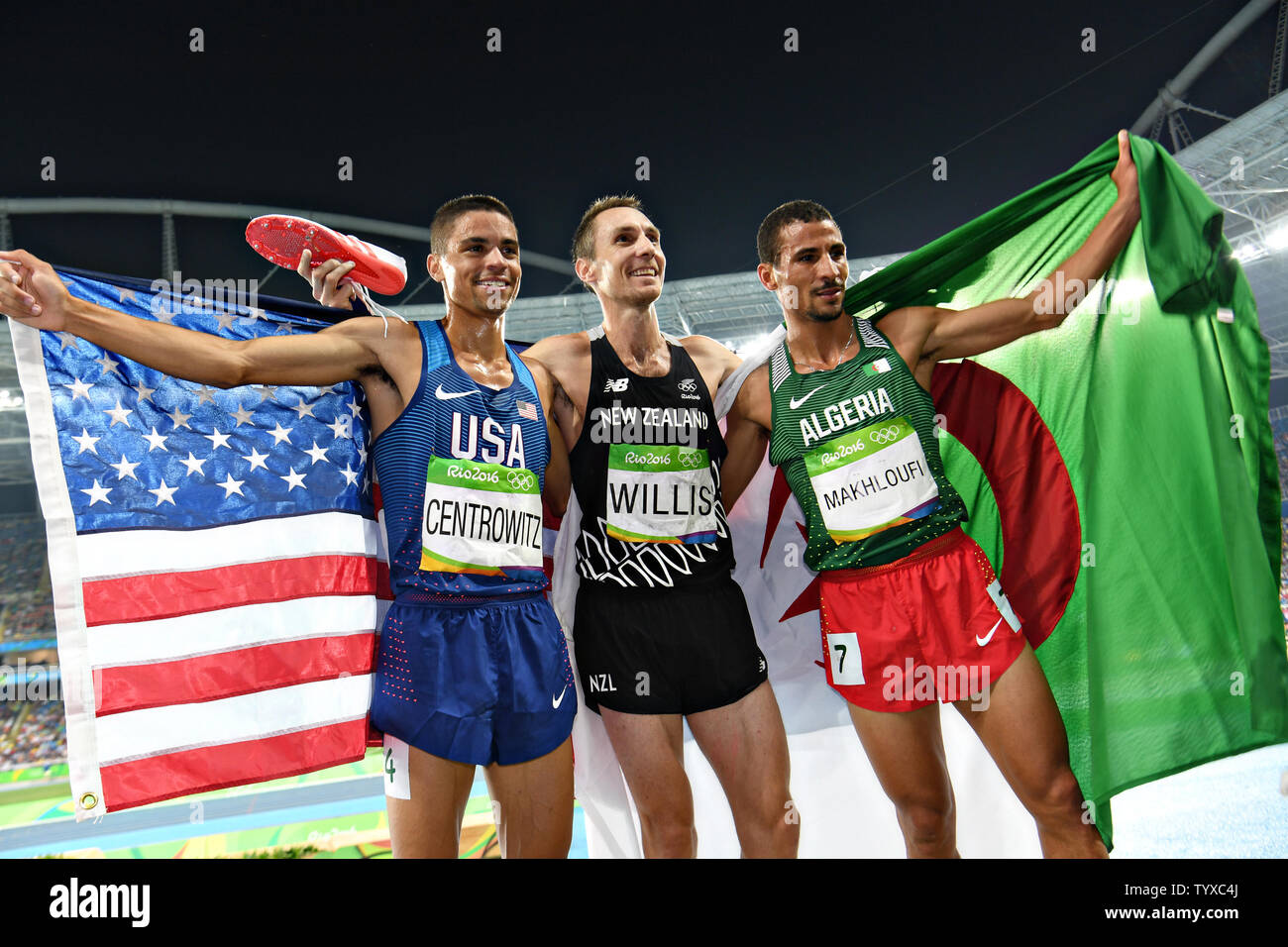 Gold medalist Matthew Centrowitz of the United States, left, poses with ...