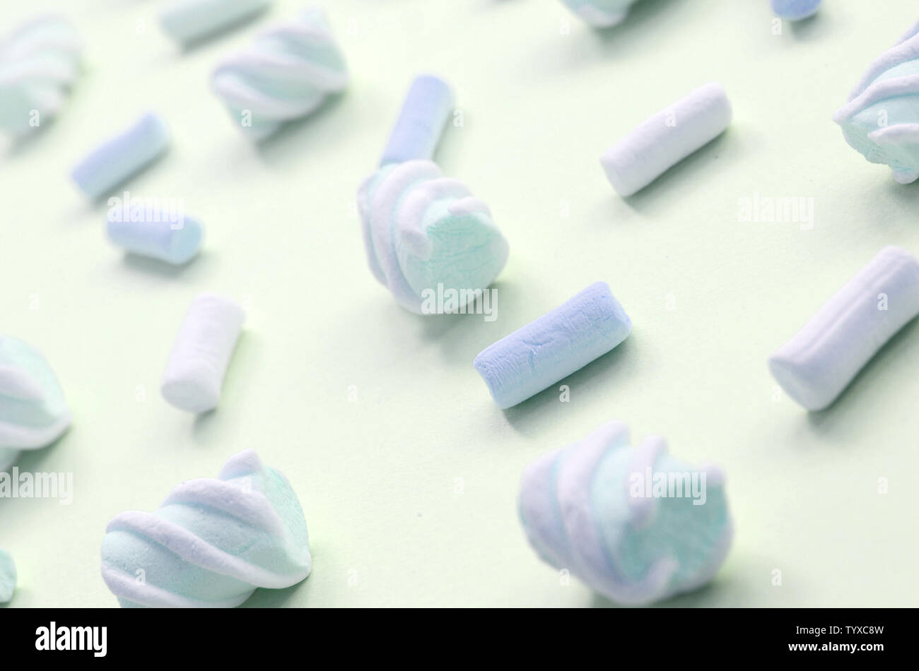 Colorful marshmallow laid out on lime paper background. pastel creative ...