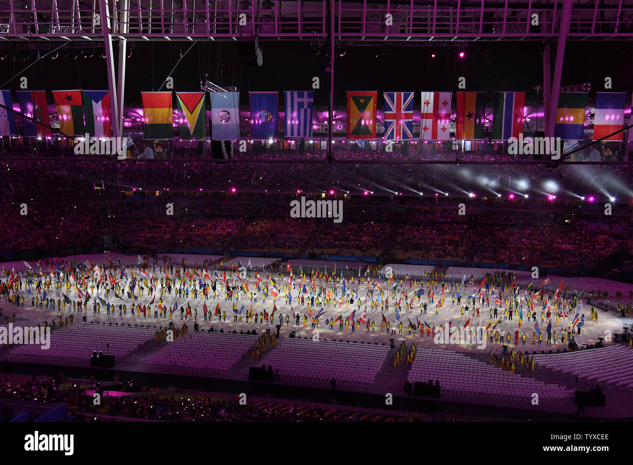 Athletes carrying their country's flag gather during the Closing ...