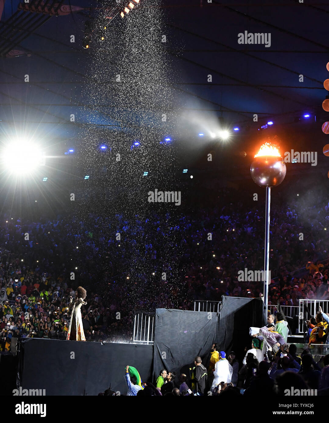 Brazilian singer Mariene de Castro sings as the Olympic flame is ...