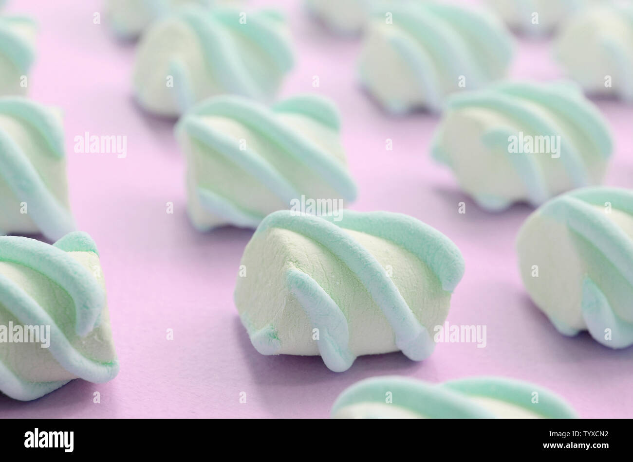 Colorful marshmallow laid out on pink paper background. pastel creative ...