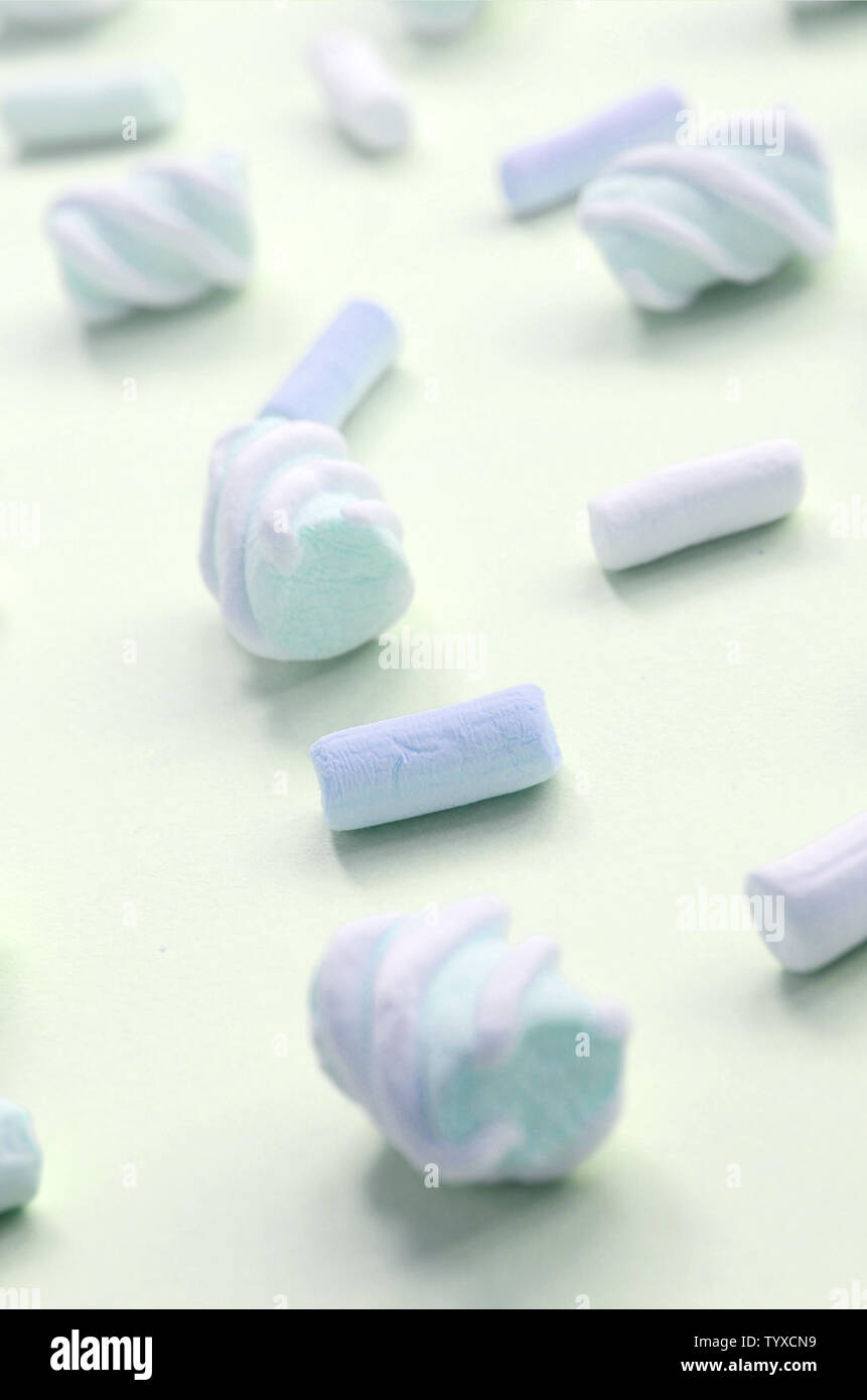 Colorful marshmallow laid out on lime paper background. pastel creative ...