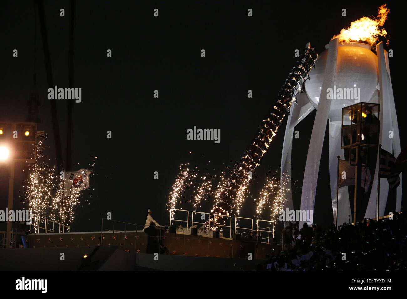 The Olympic Torch is lit during the opening ceremony at the Pyeongchang ...