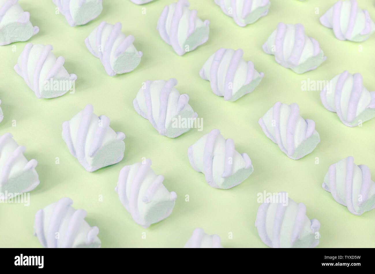 Colorful marshmallow laid out on lime paper background. pastel creative ...