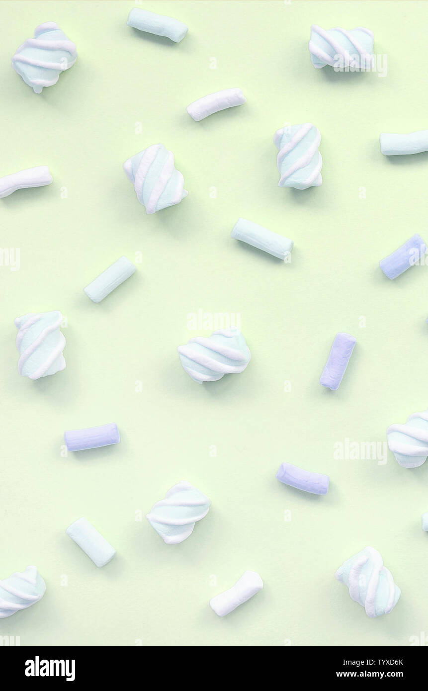 Colorful marshmallow laid out on lime paper background. pastel creative ...