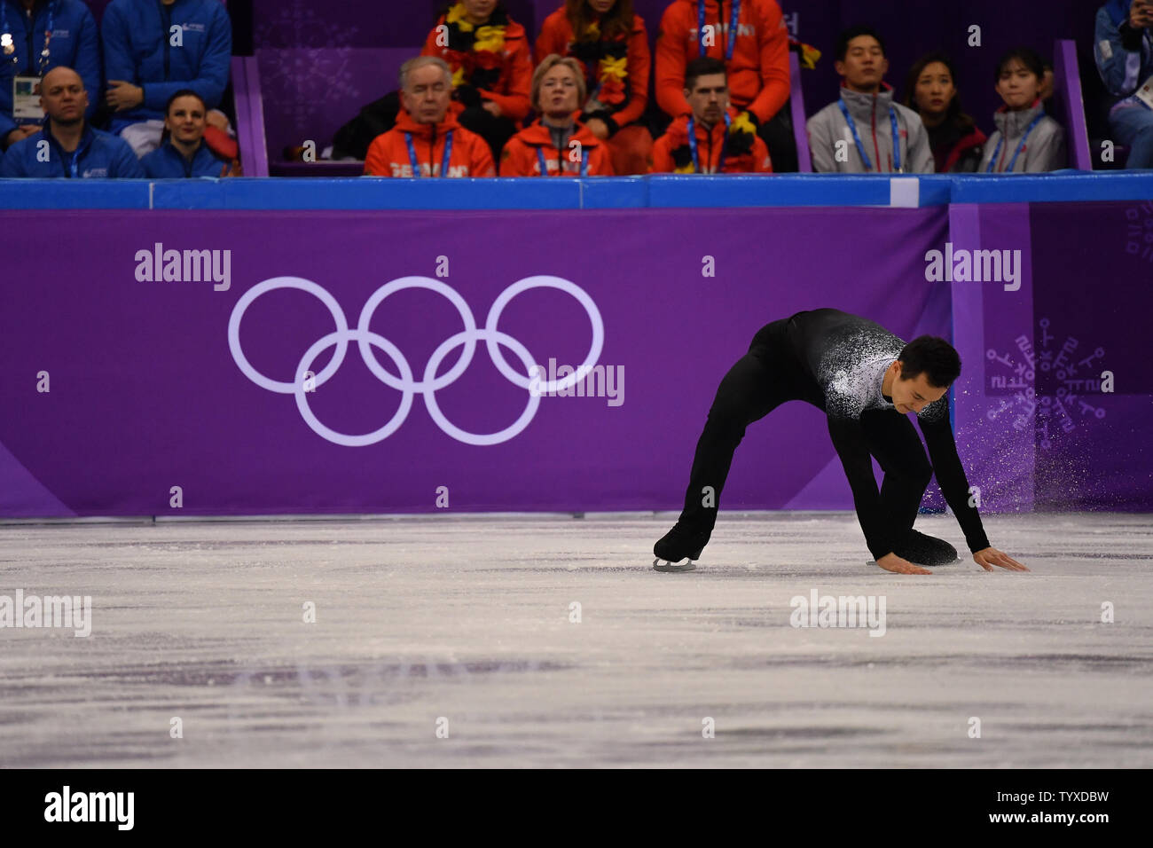 Figure skater Patrick Chan of Canada takes a fall during Men's Single ...