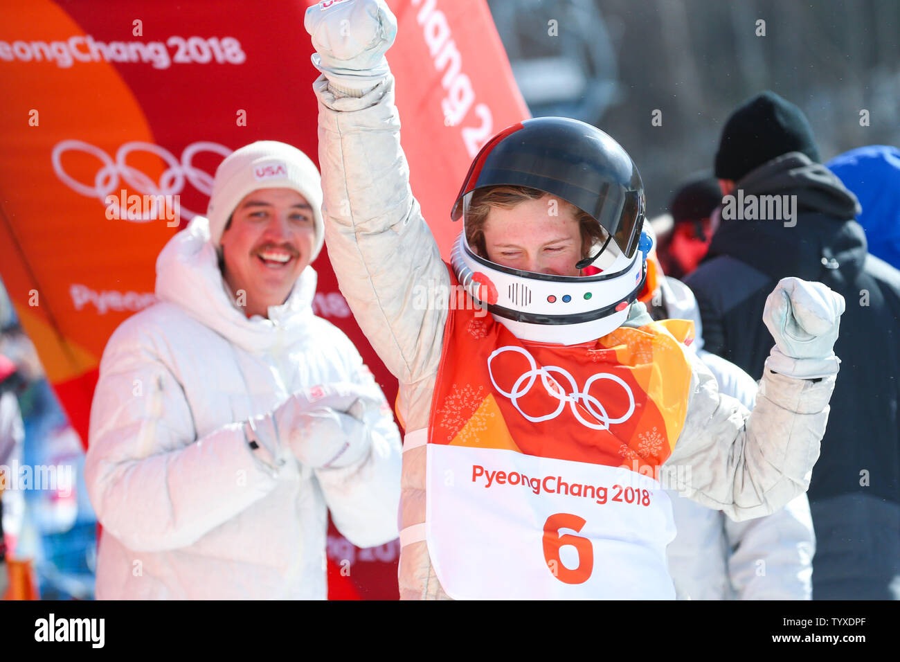 American Redmond Gerard pumps his fist while wearing a space helmet ...