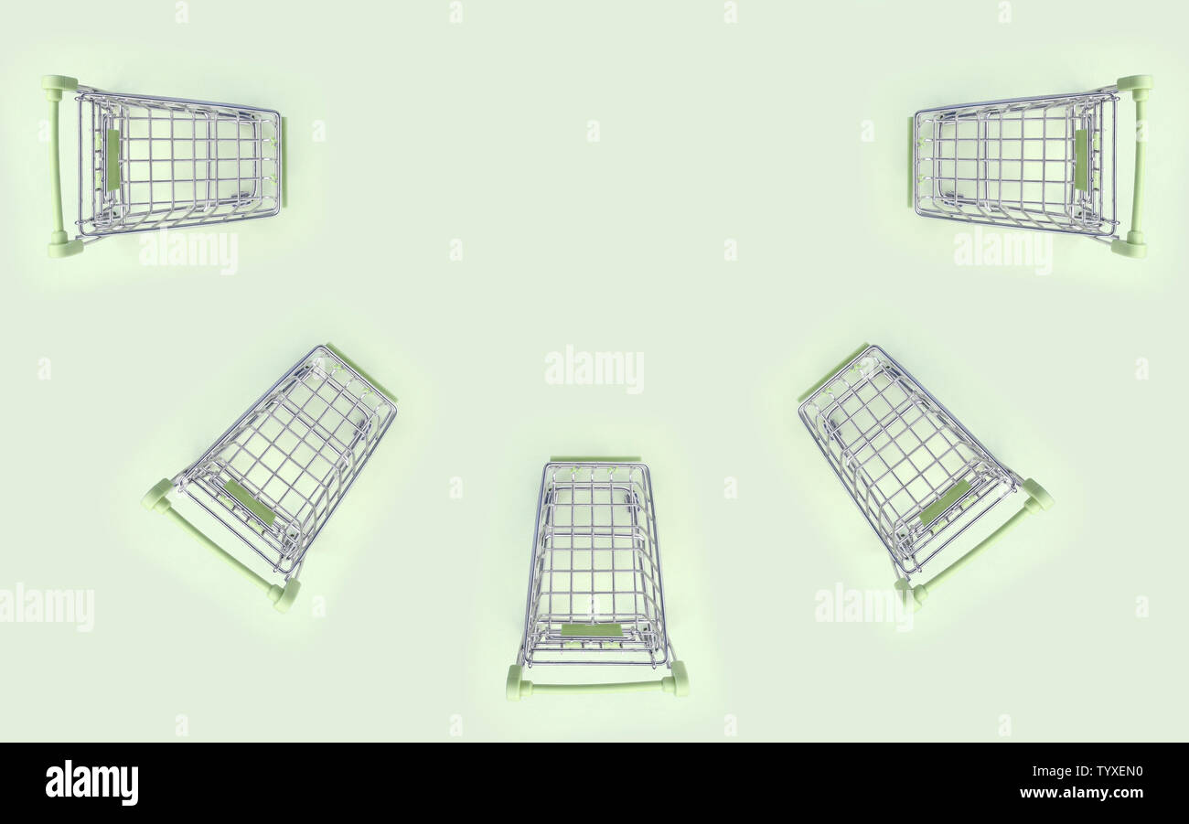 Pattern of many small shopping carts on a lime background. Minimalism ...