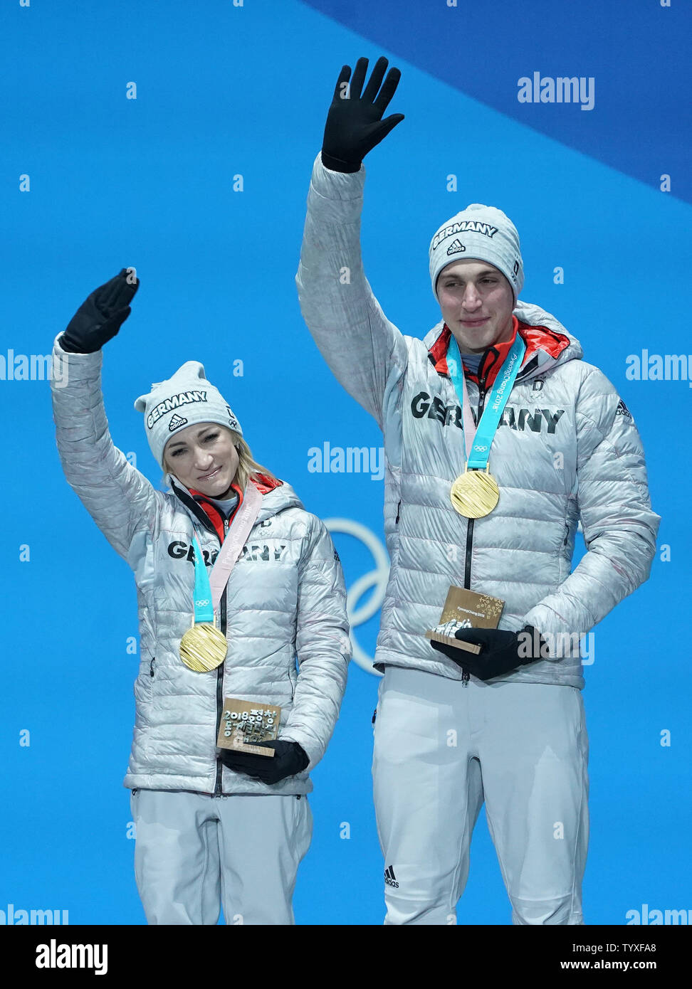 Gold Medalist Germanys Aljona Savchenko And Bruno Massot Celebrate During The Medal Ceremony