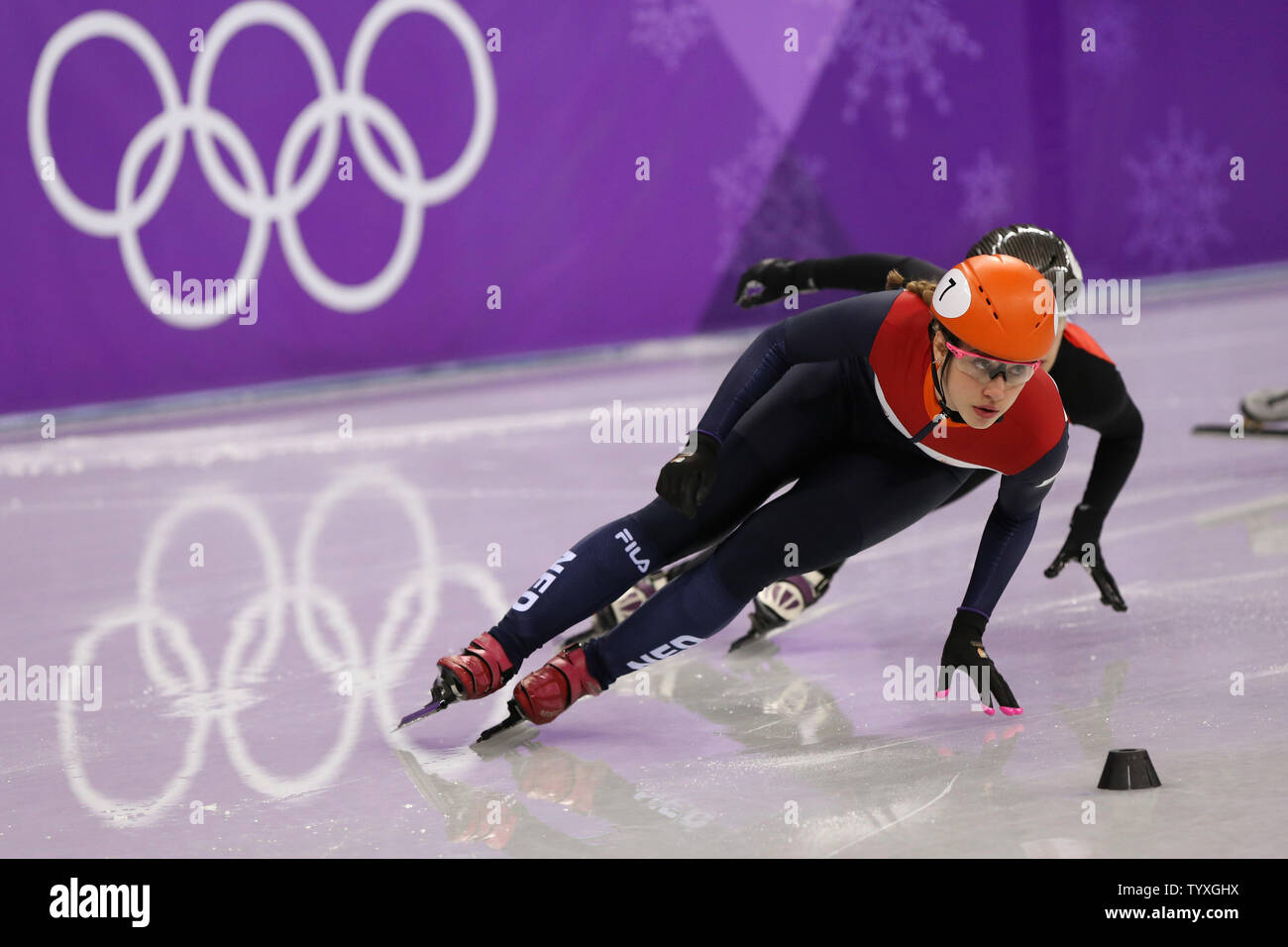 Skater Suzanne Schulting of the Dutch relay team leads as she helps her ...