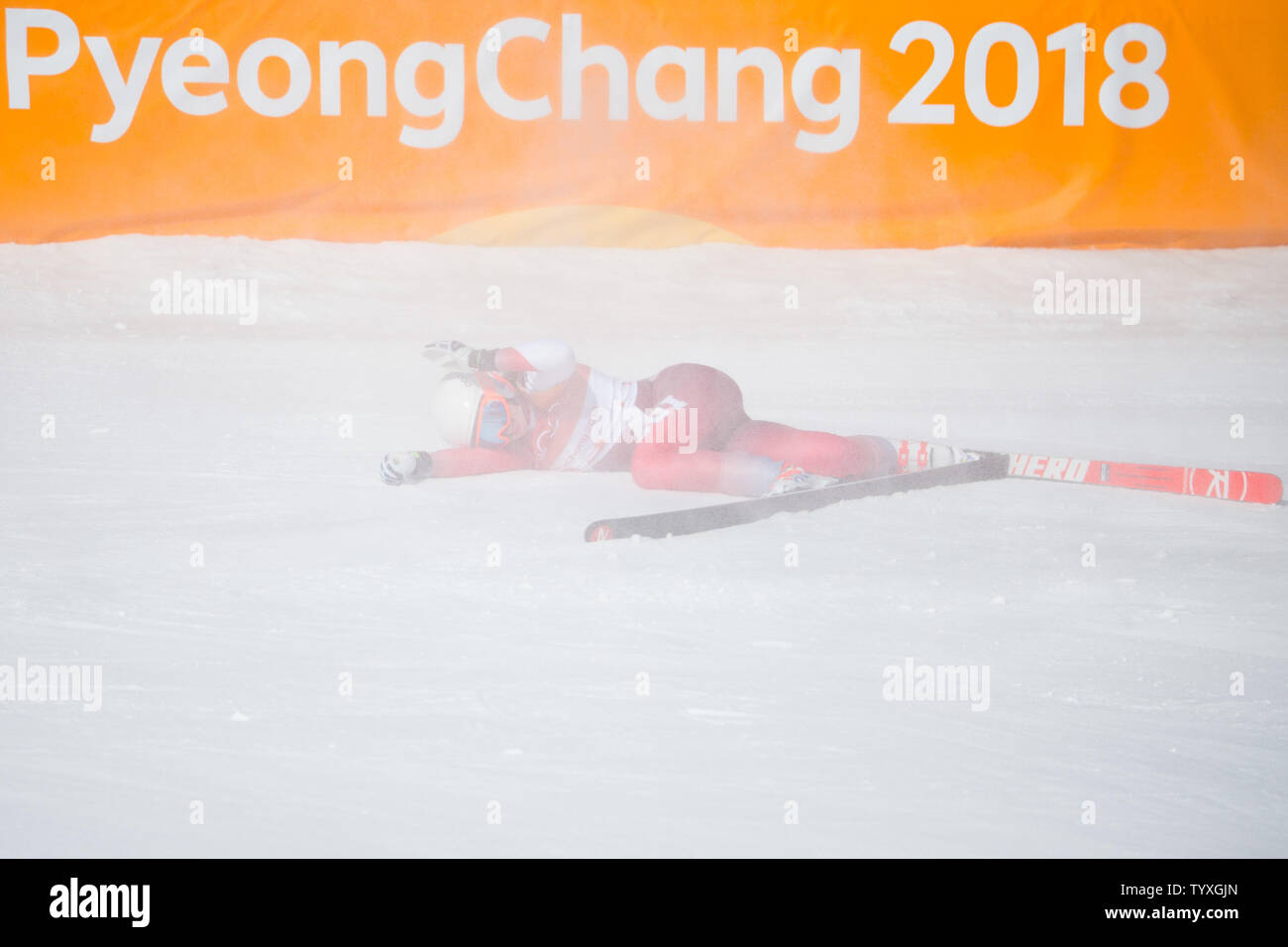 Michelle Gisin of Switzerland lays in the snow after sliding across the ...
