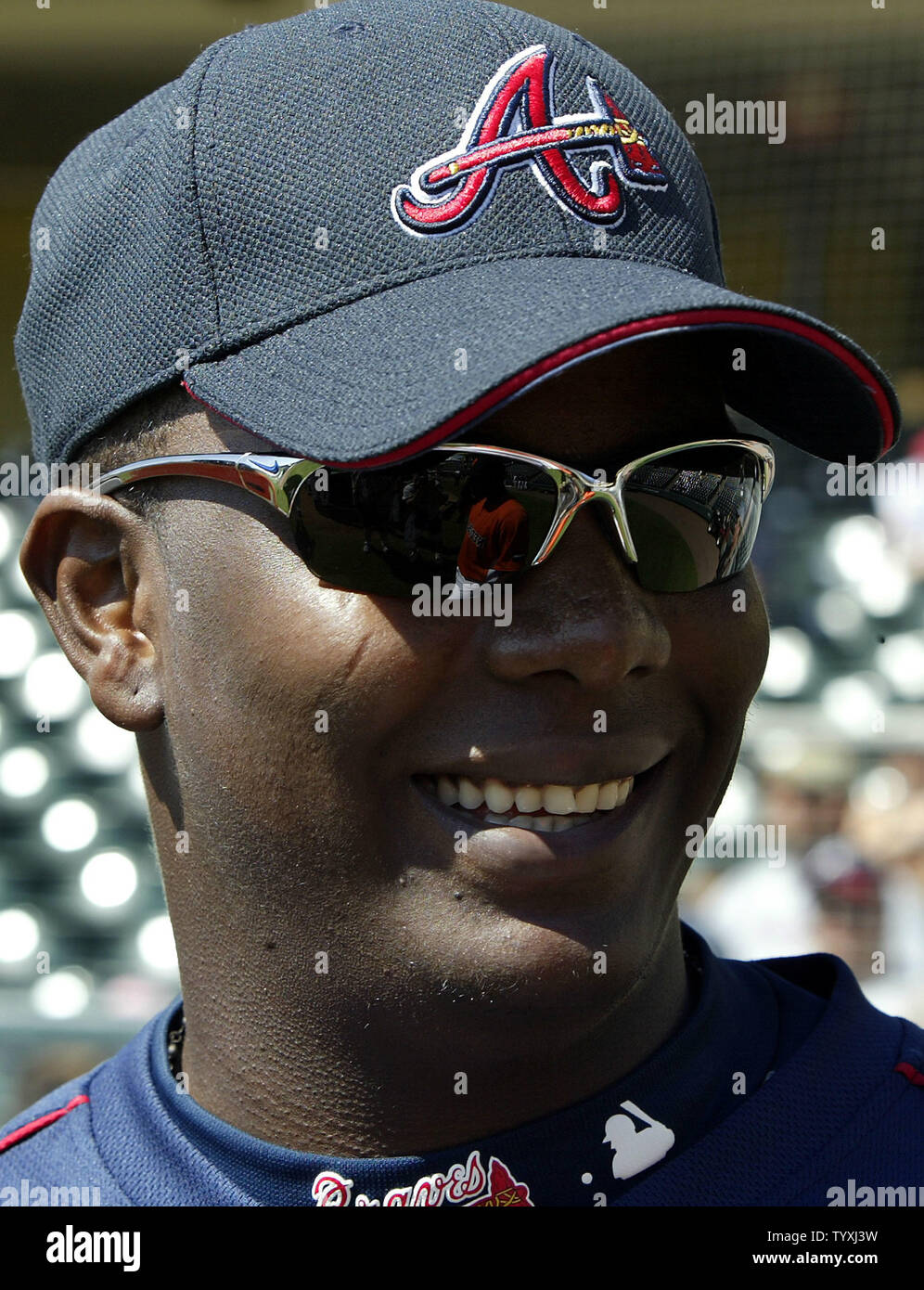 Atlanta Braves' Edgar Renteria smiles at his teammate Andruw Jones ...