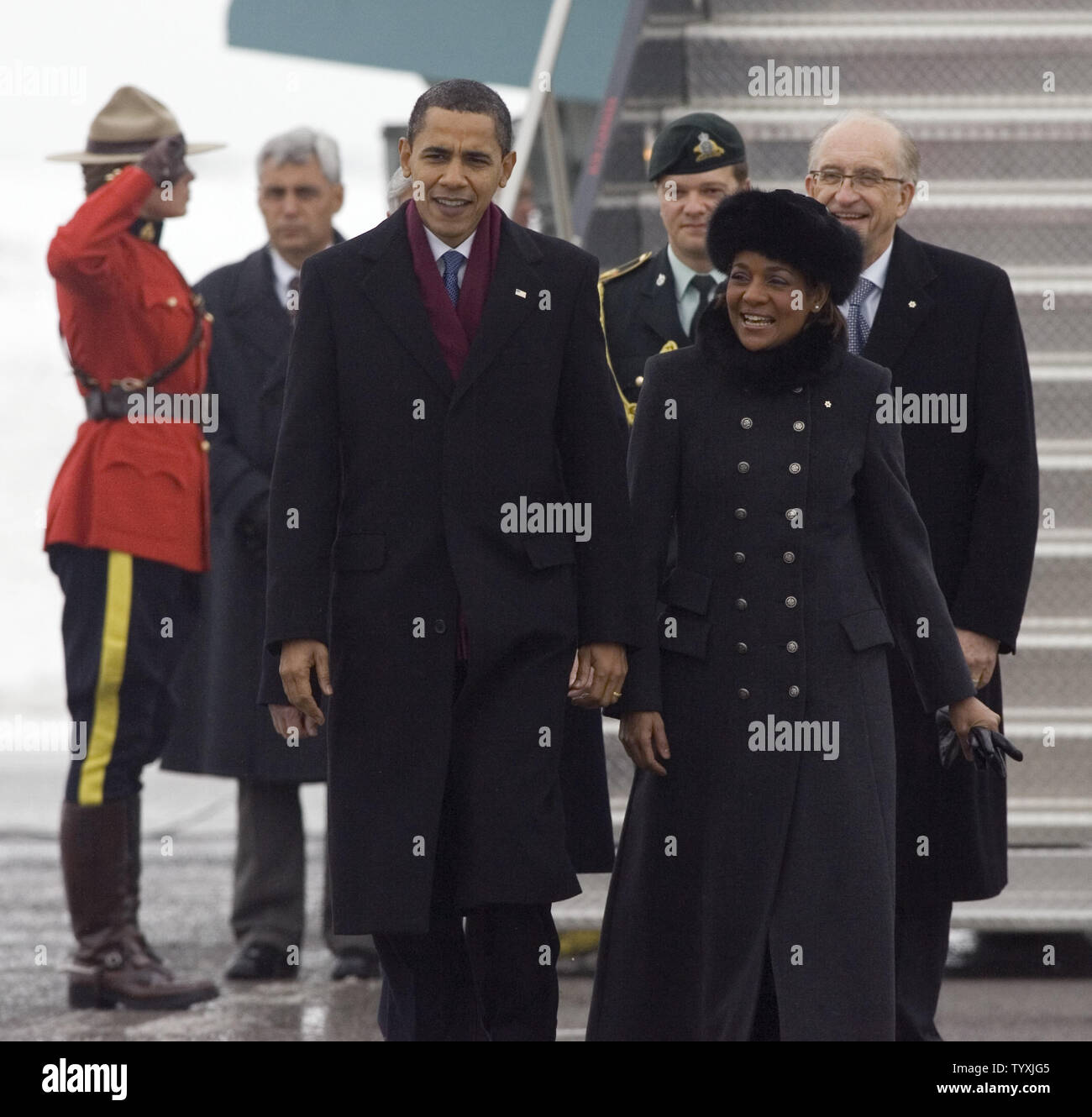 Recently elected U.S. President Barack Obama is greeted and escorted by the Governor General of ...
