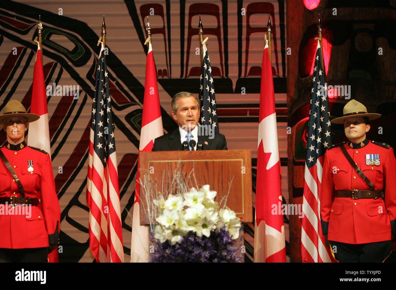 Flanked by Royal Canadian Mounted Police, President George W. Bush ...