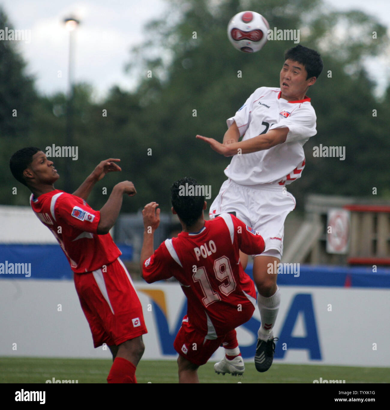 North Korea's forward Chol Min Jong (R) heads the ball against Panama's ...