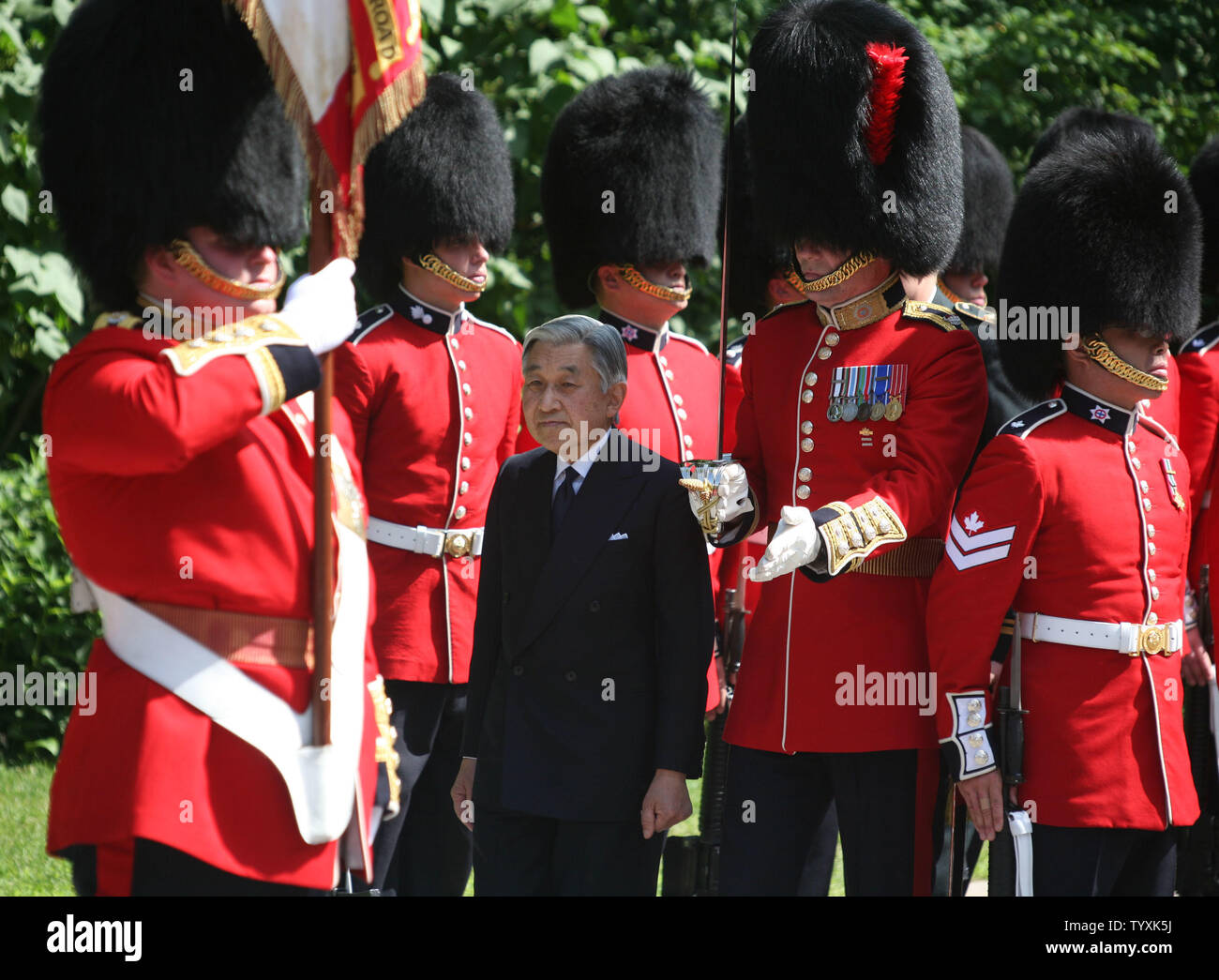 Emperor Akihito of Japan inspects the ceremonial royal guard at Rideau ...