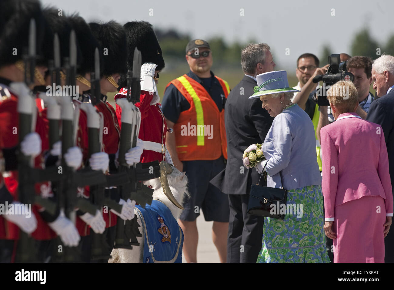 Great Britain's Queen Elizabeth stops to look at Batisse the billy goat ...