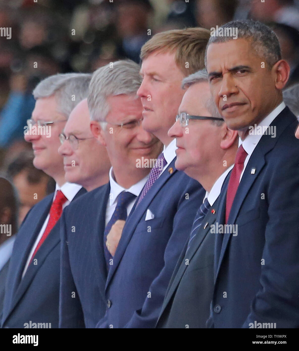 U.S. President Barack Obama (R) stands among other dignitaries at Sword ...