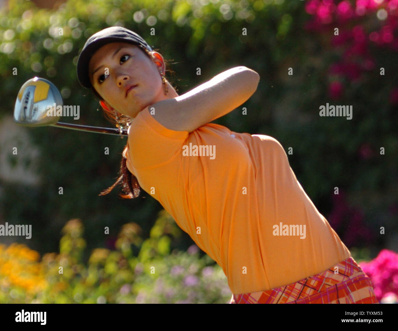 Michelle Wie watches her drive off the 15th tee in her debut as a ...