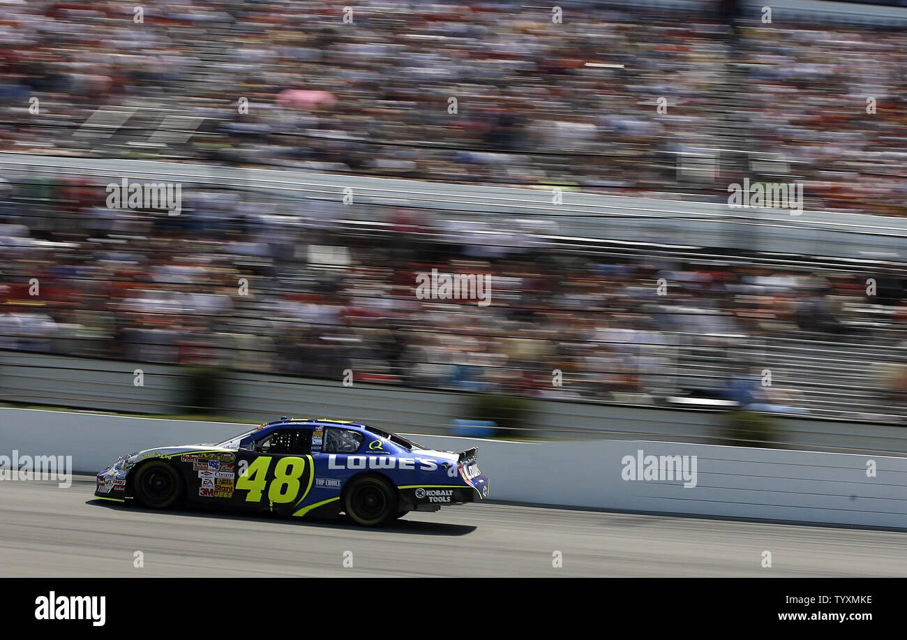 Jimmie Johnson comes around turn three during the Nascar Pennsylvania ...