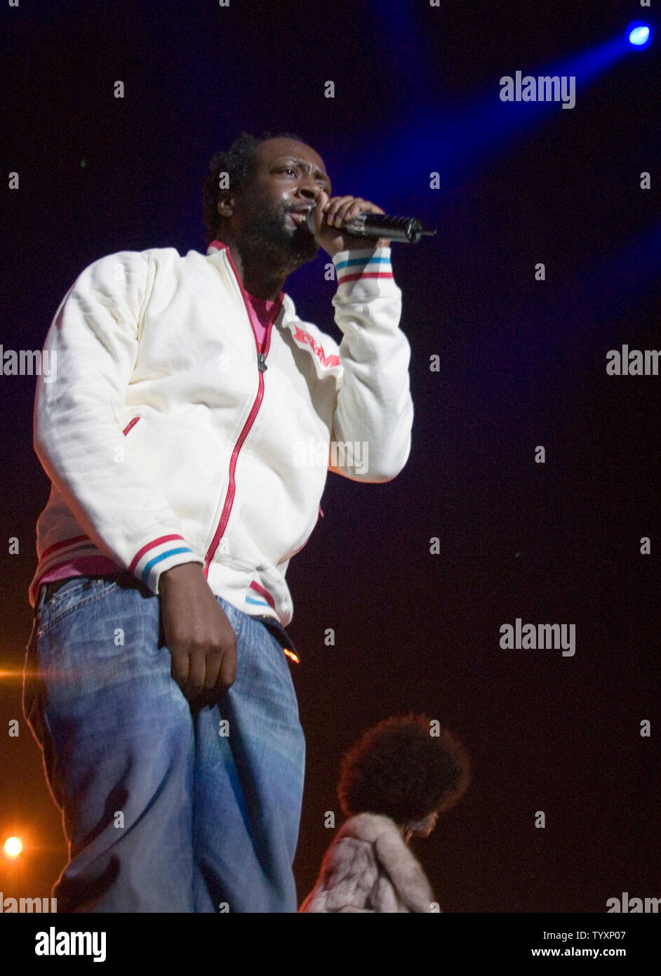 Singer Wyclef Jean of The Fugees performs on stage with Lauren Hill ...